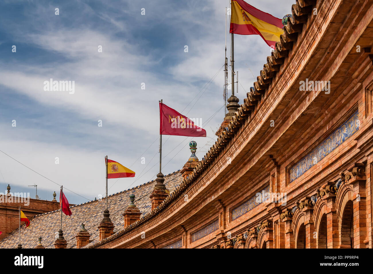 Spanish flags flying above the buildings in Plaza de Espana, Seville ...