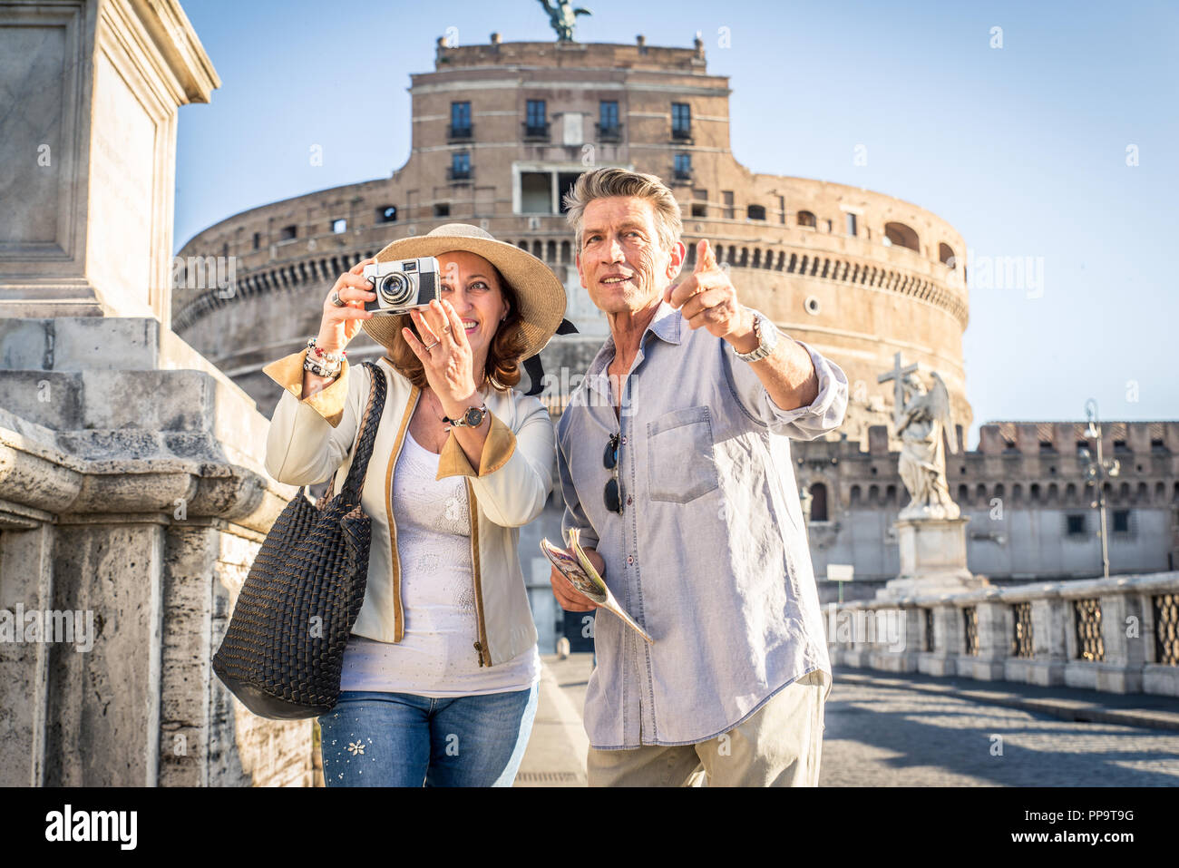 Senior couple at Castel Sant' Angelo, Rome - Happy tourists visiting ...