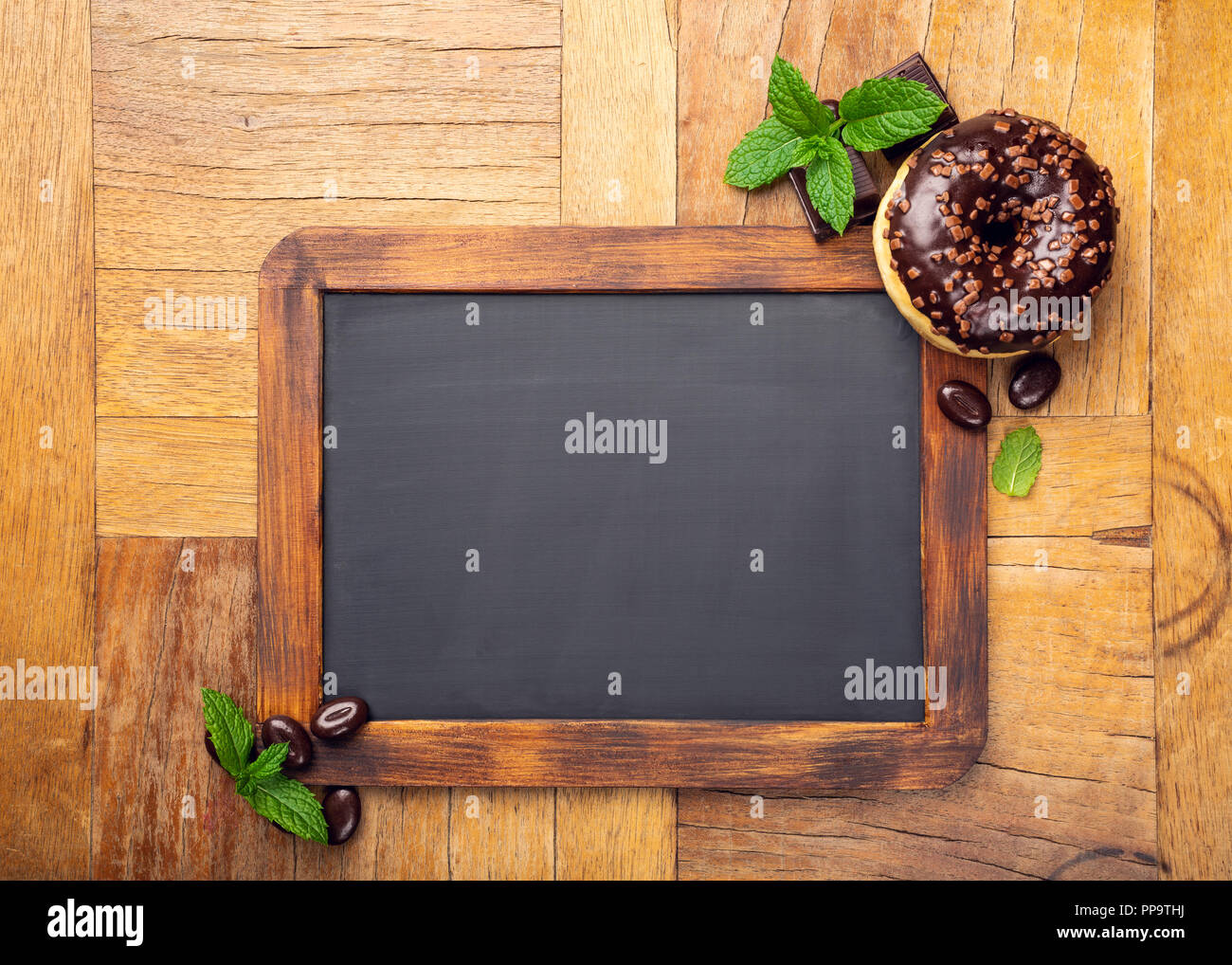 Black chalkboard with chocolate glazed donut Stock Photo - Alamy