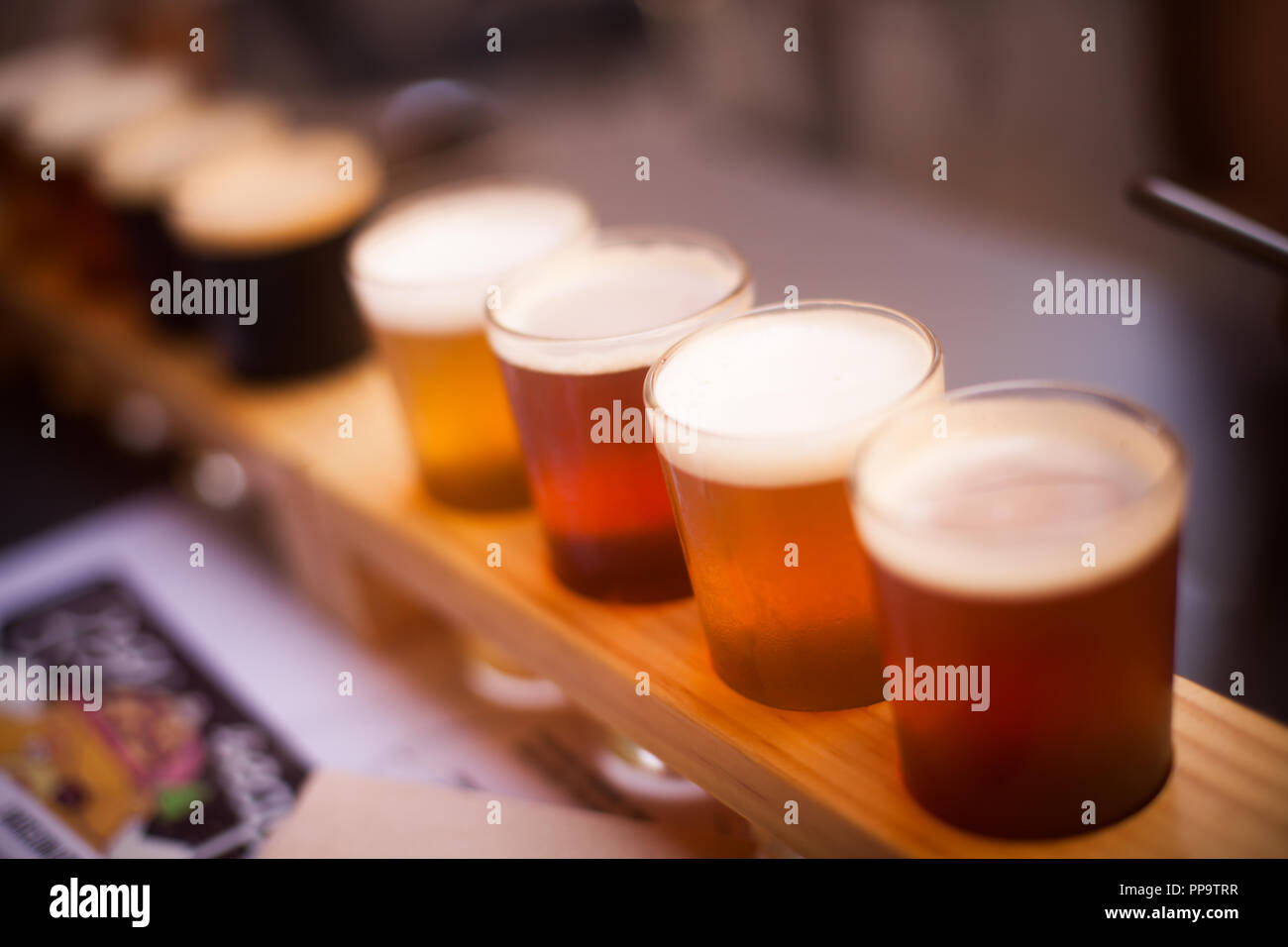 Selection of beers on a tasting mat Stock Photo - Alamy