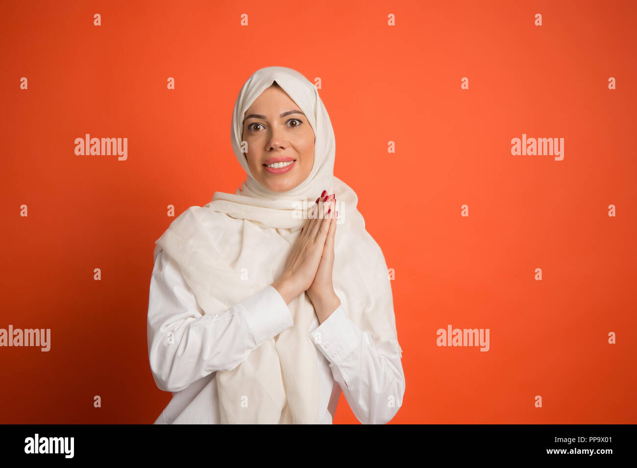 Happy arab woman in hijab. Portrait of smiling girl, posing at red ...