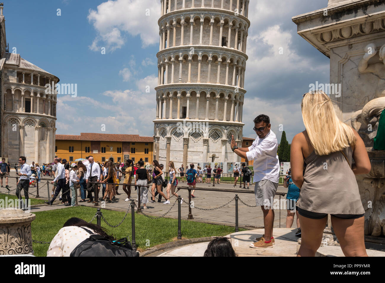Tourist posing against the Leaning Tower of Pisa, Tuscany, Italy Stock ...