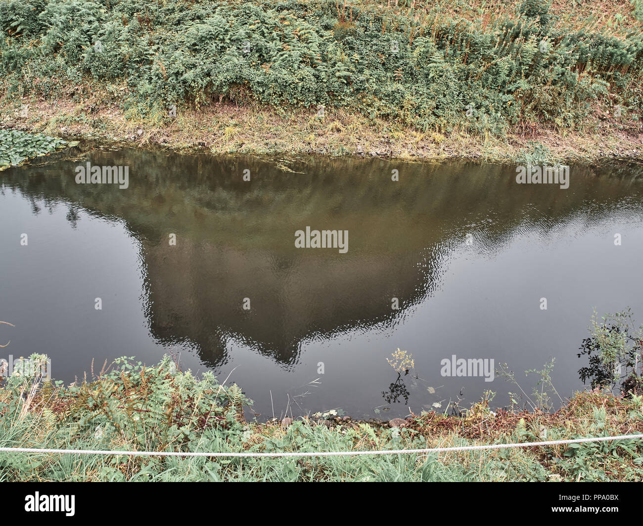 View of the castle of Cardiff shadow in the moat of the castle Stock ...