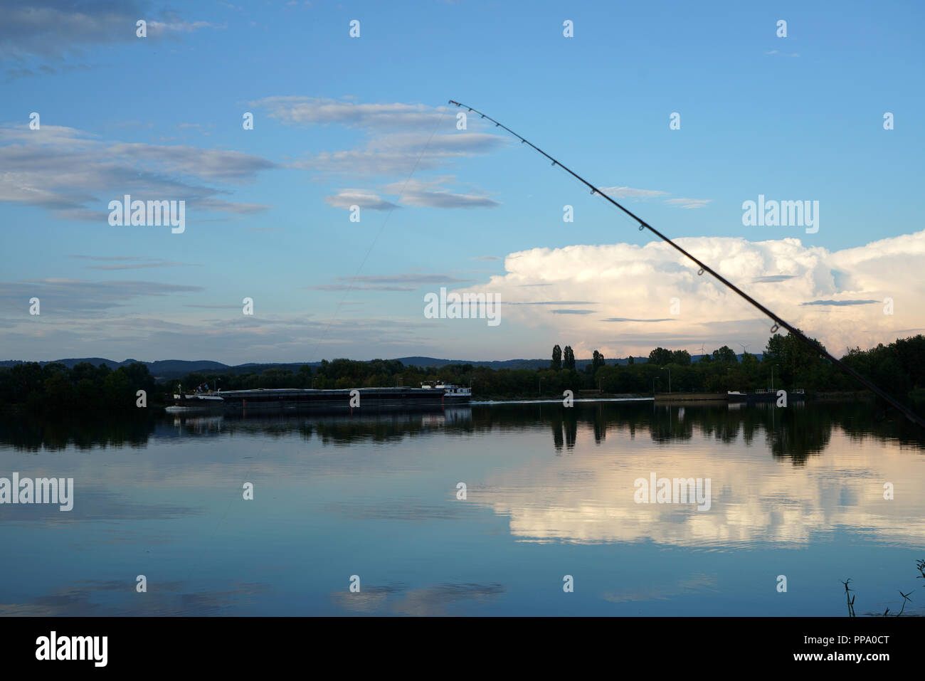 Fishing in Germany on a warm summer evening on the Danube Stock Photo ...
