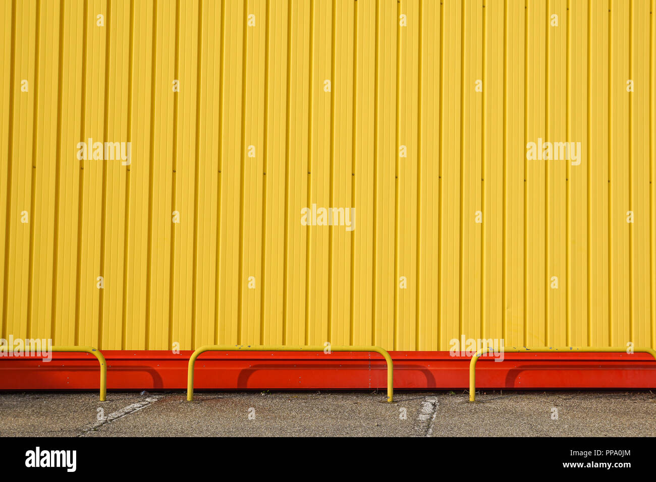 yellow metal panel construction, wall of building with blue sky Stock ...