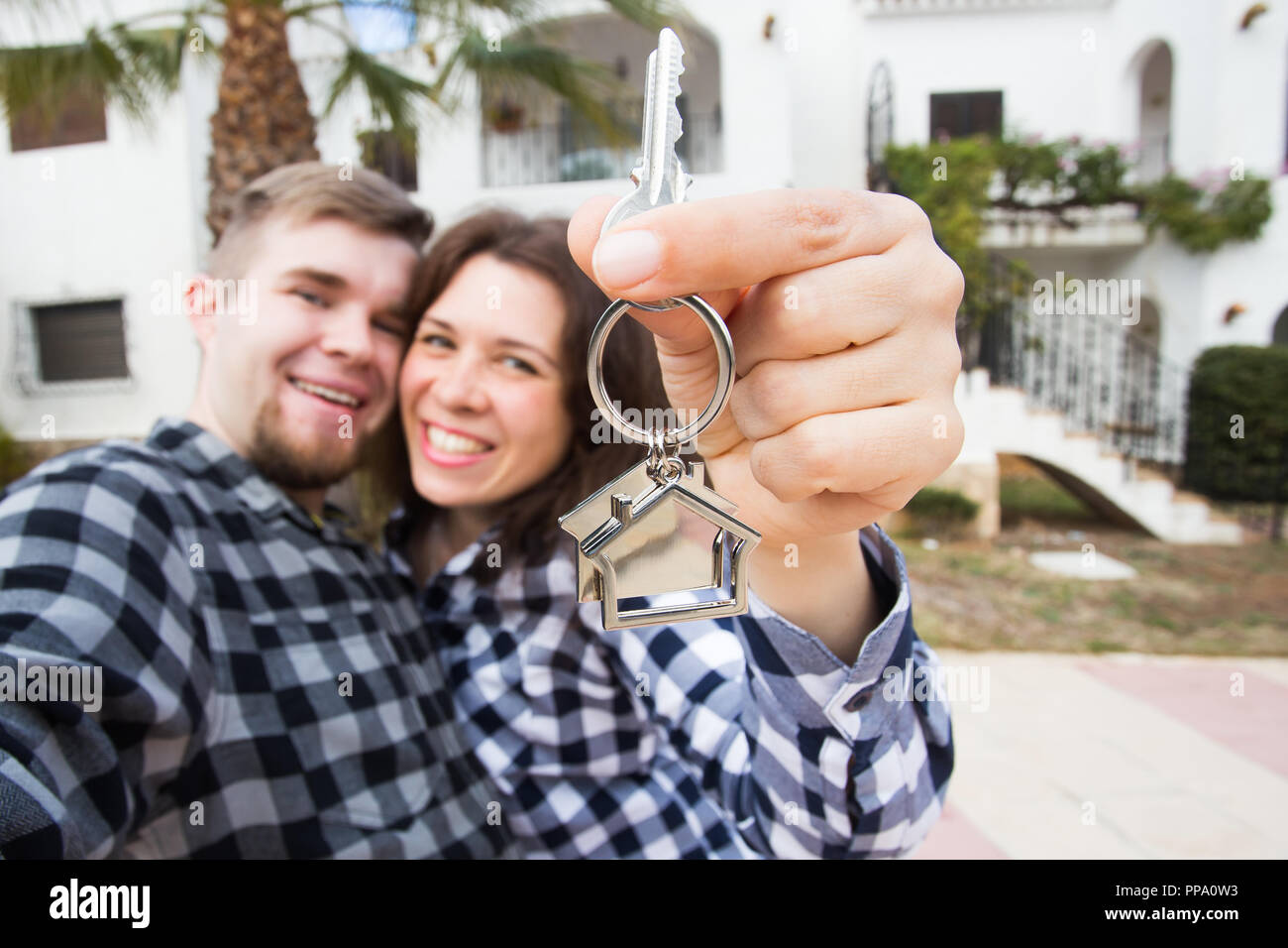 Moving and real estate concept - Happy young laughing cheerful couple ...