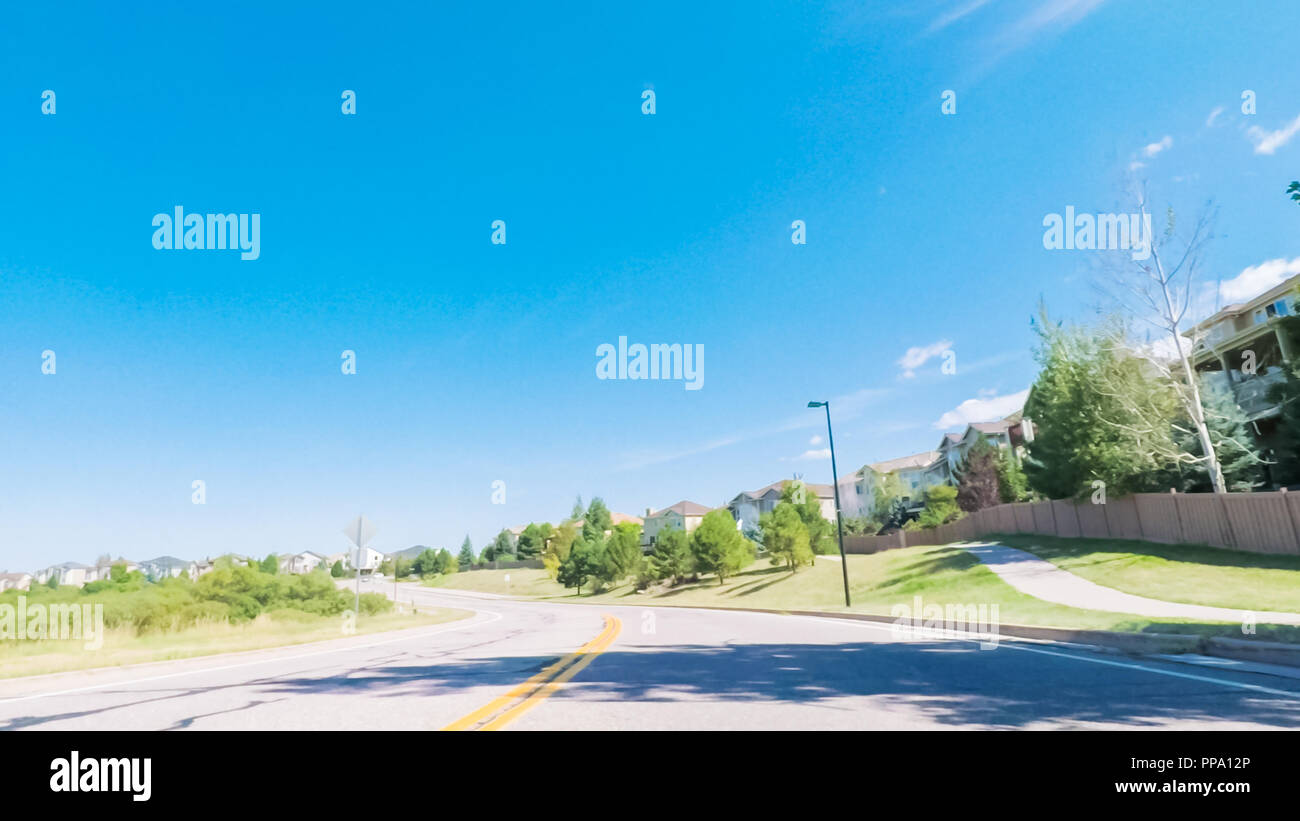 Driving on paved roads in suburban neighborhood south of Denver ...
