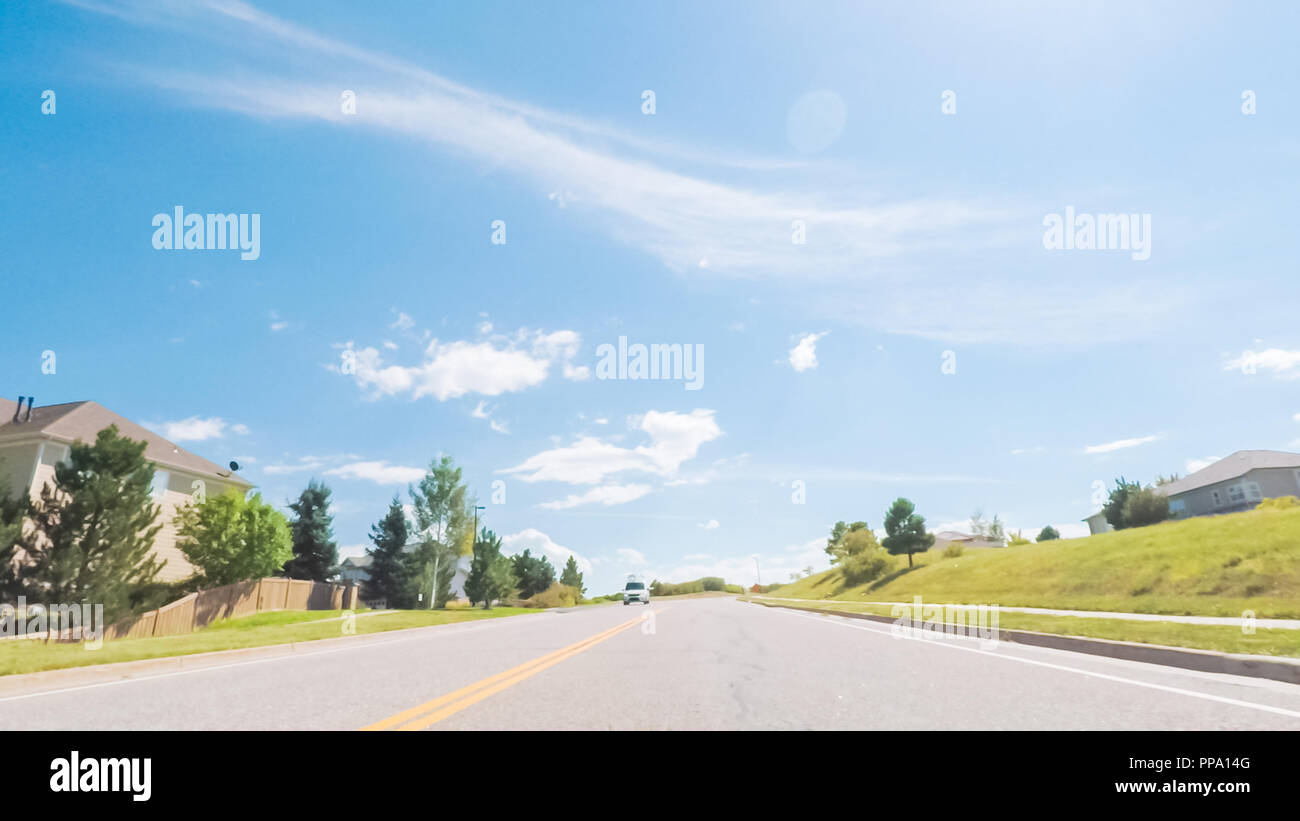 Driving on paved roads in suburban neighborhood south of Denver ...
