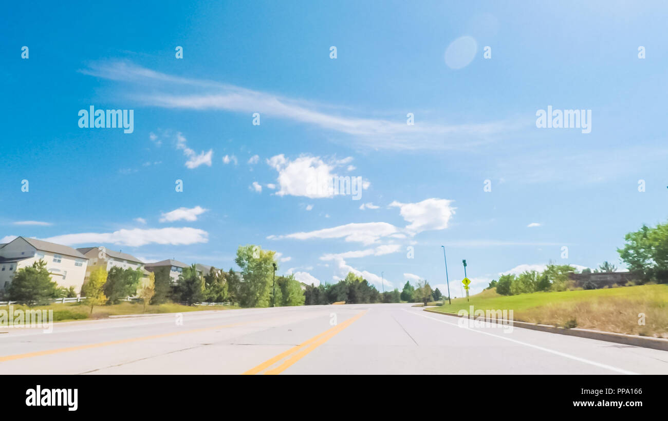 Driving on paved roads in suburban neighborhood south of Denver ...