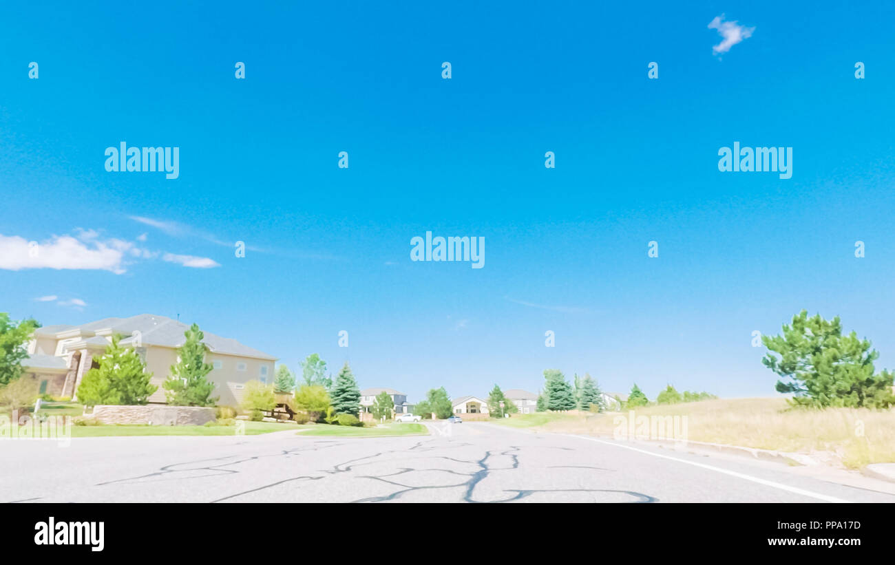Driving on paved roads in suburban neighborhood south of Denver ...