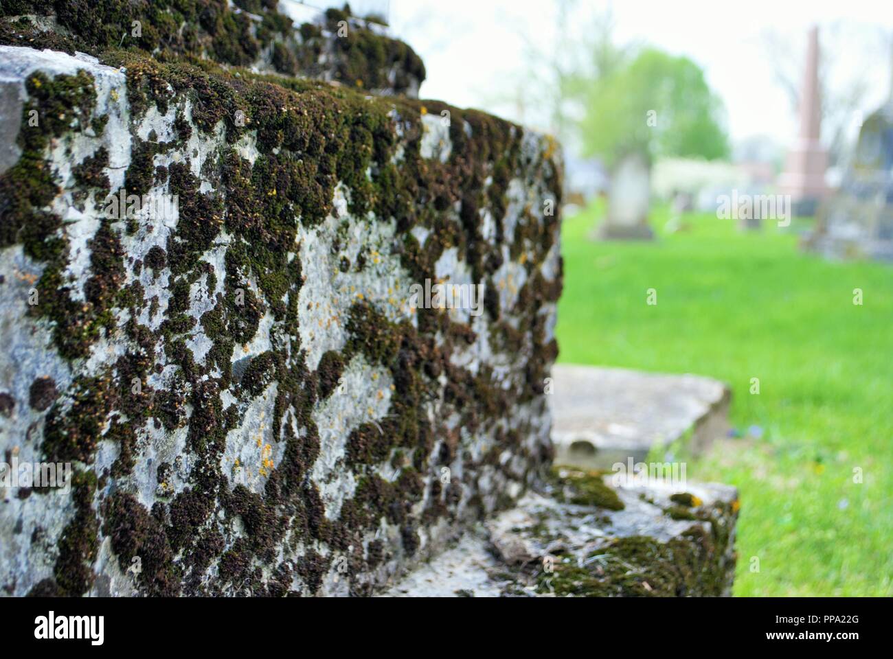 very old moss covered statue / headstone in a cemetery Stock Photo - Alamy