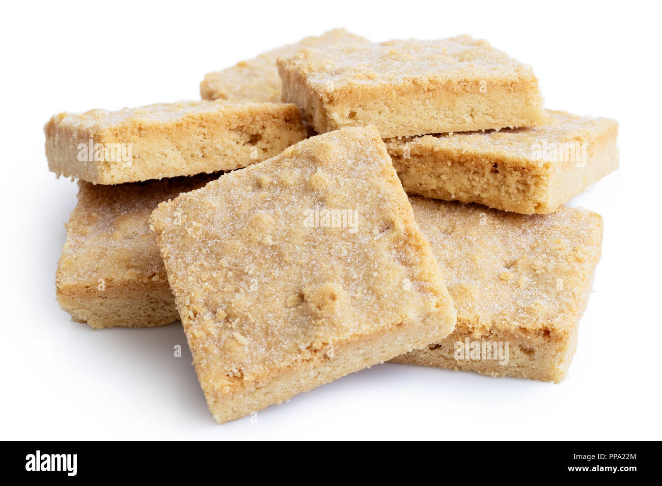 Pile of classic homemade square shortbread biscuits isolated on white ...
