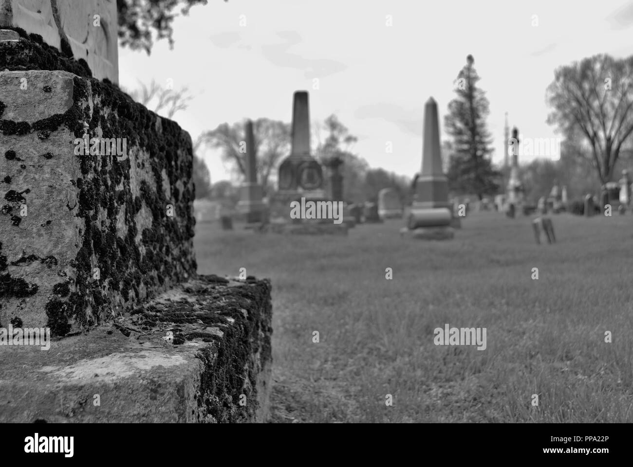 very old moss covered statue / headstone in a cemetery Stock Photo - Alamy