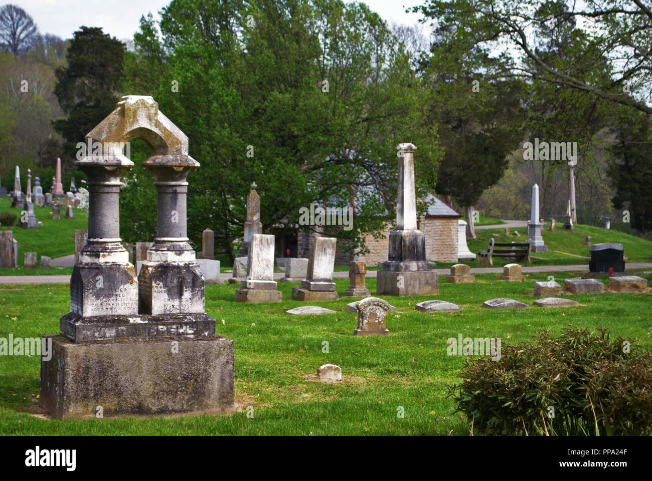 very old moss covered statue / headstone in a cemetery Stock Photo - Alamy