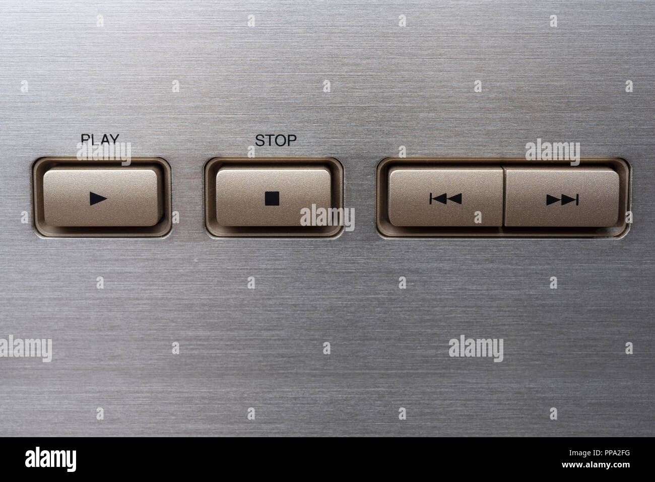 Metal play button, stop and fast rewind on metal case like background ...