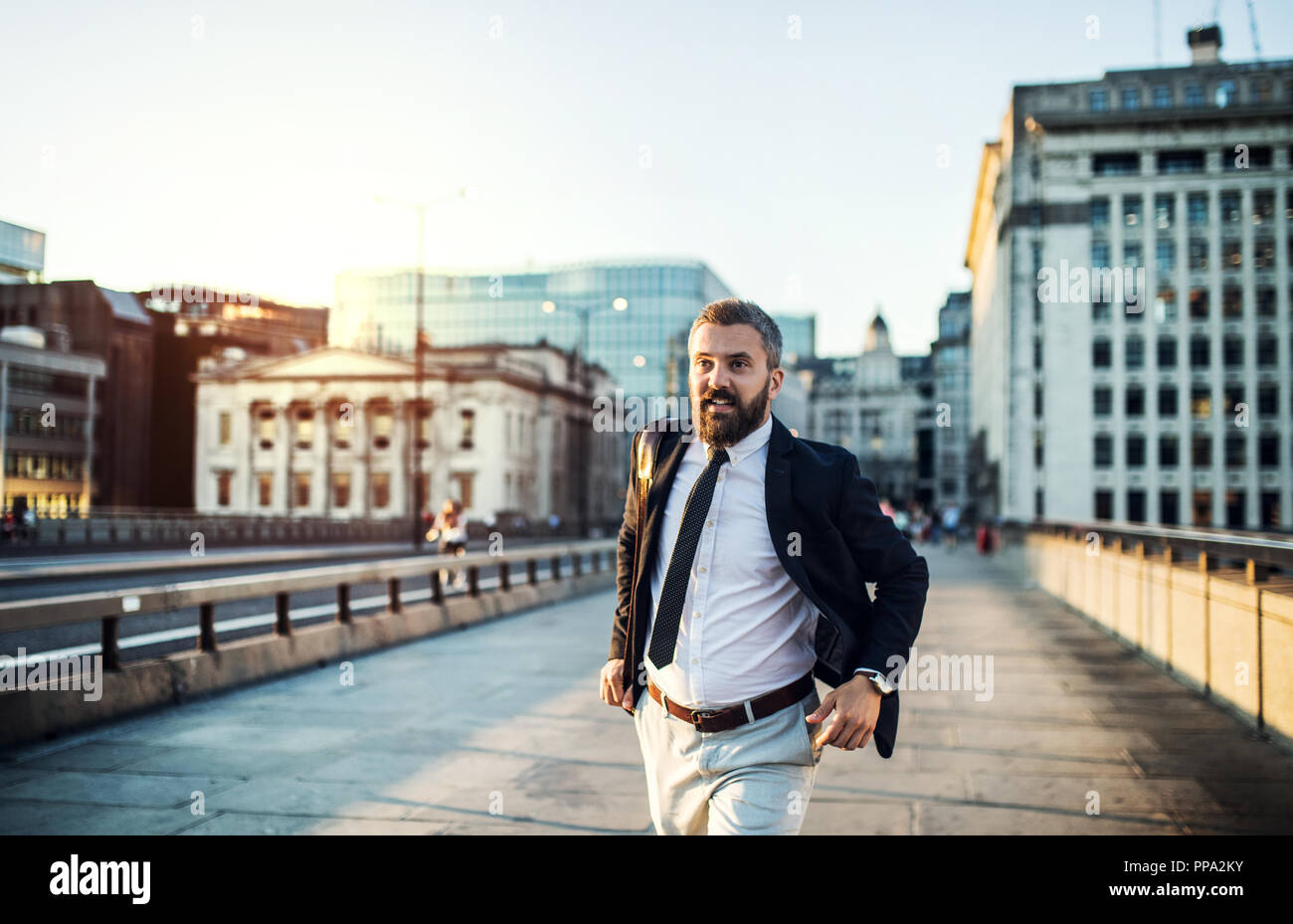 Business man running on street hi-res stock photography and images - Alamy