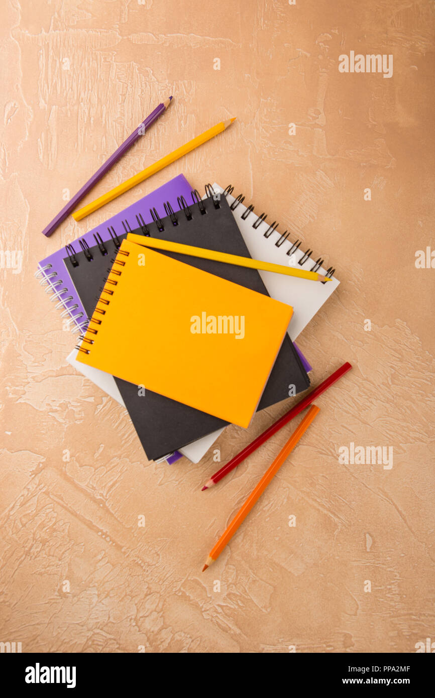 A stack of multi-colored notebooks on a spiral Stock Photo - Alamy