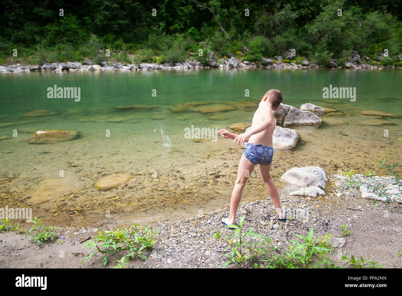 Boy throwing stones hi-res stock photography and images - Alamy