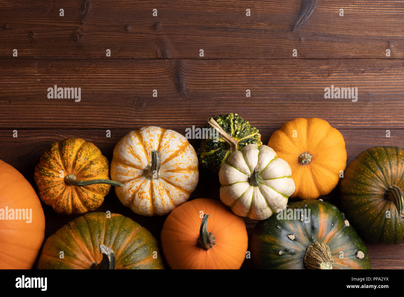 Many orange pumpkins on wooden background , Halloween concept , top ...
