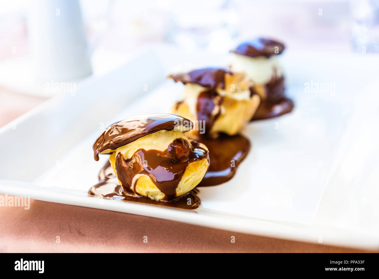 Profiteroles chocolate hi-res stock photography and images - Alamy