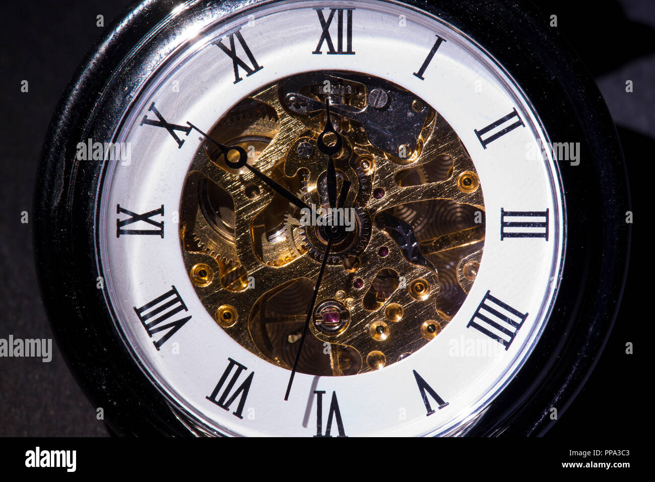 Macro of a pocket watch showing it's clockwork mechanism Stock Photo ...