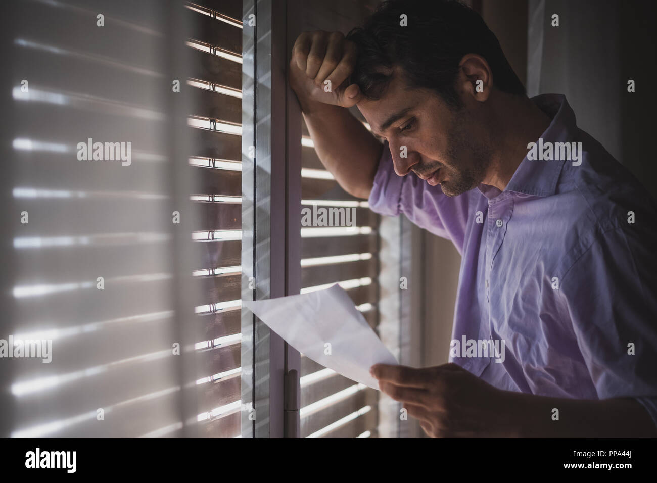 Young Man Reading Letter High Resolution Stock Photography and Images ...
