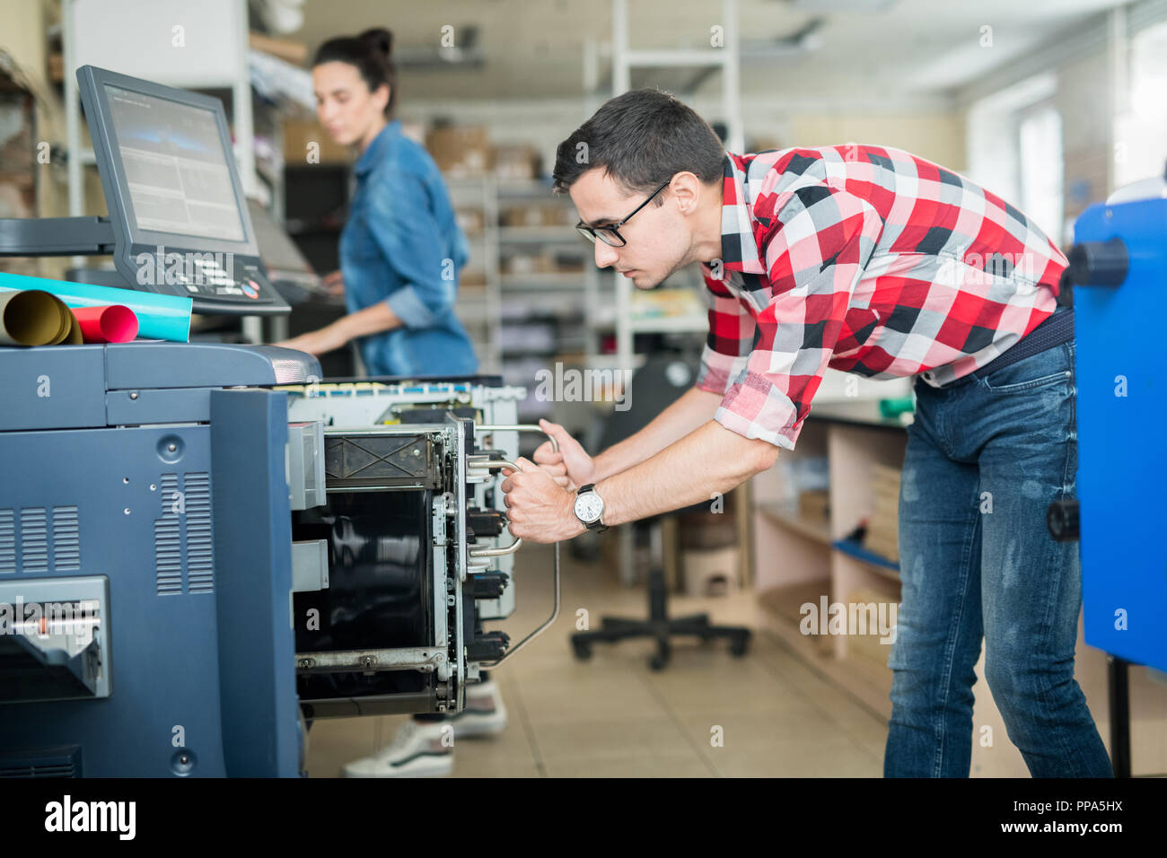 Man in typography working with printer Stock Photo - Alamy
