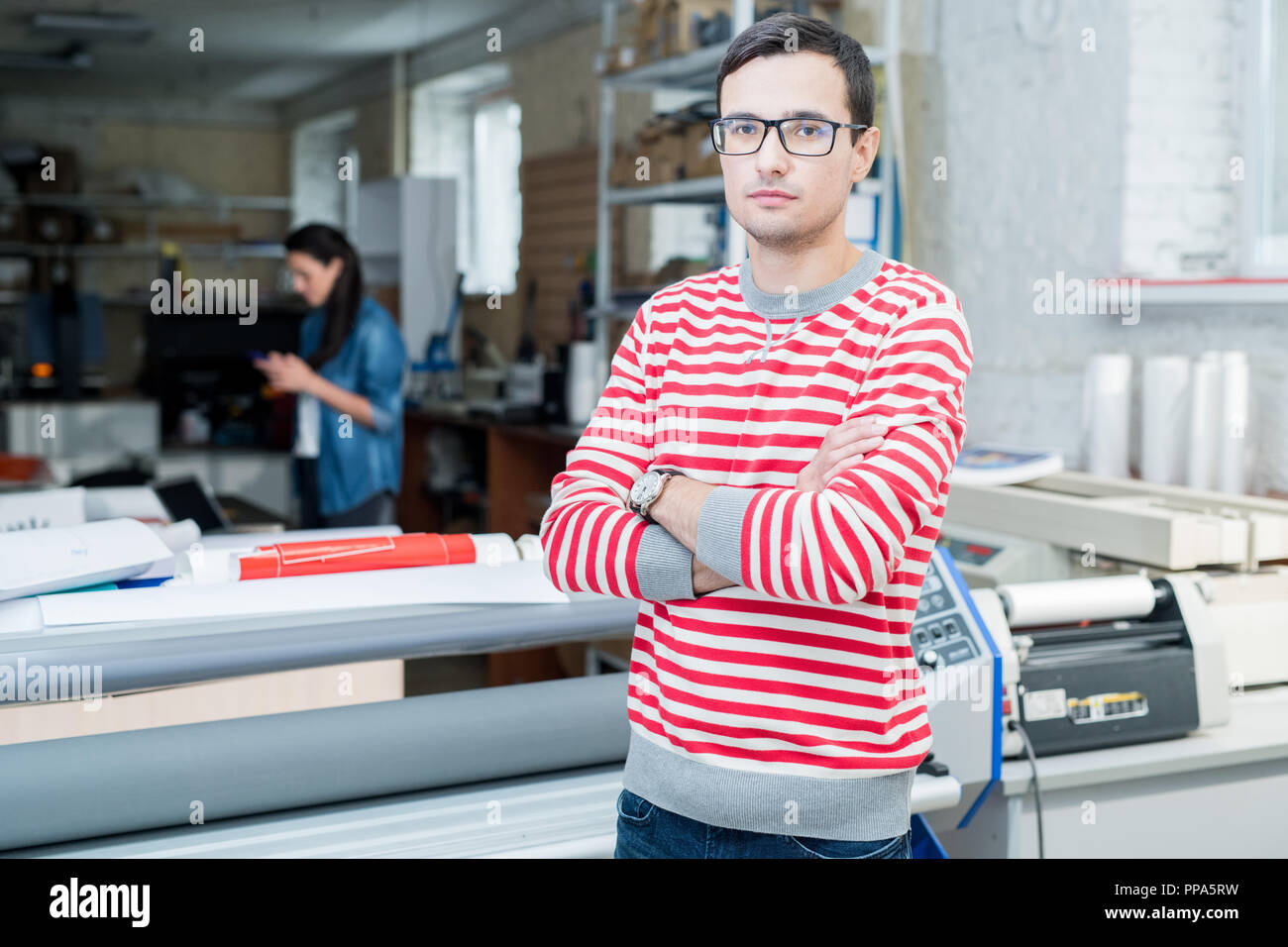 Serious production young worker hi-res stock photography and images - Alamy