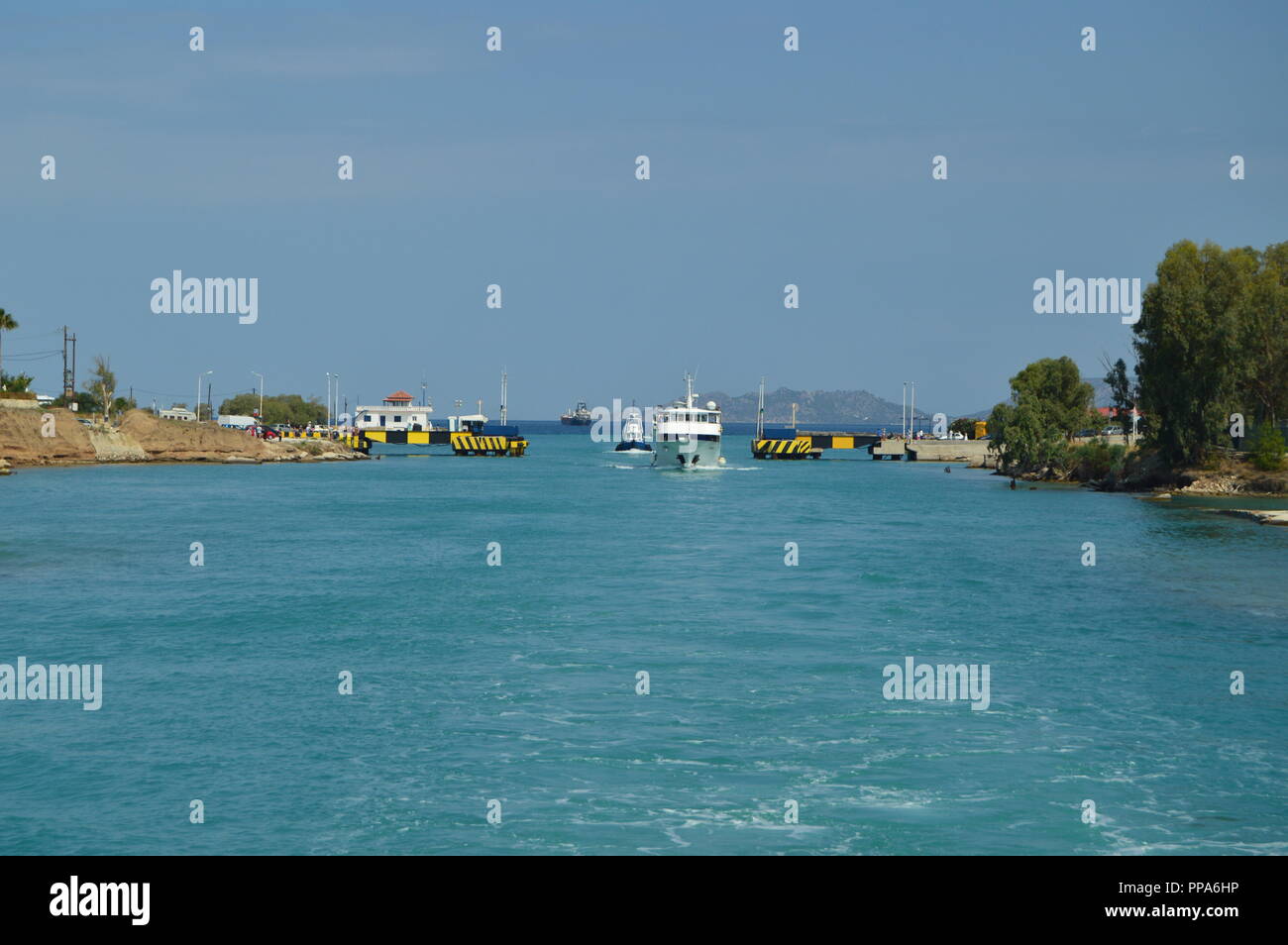 Boats Sailing At The Entrance Of The Corinth Canal Where They Bind But ...
