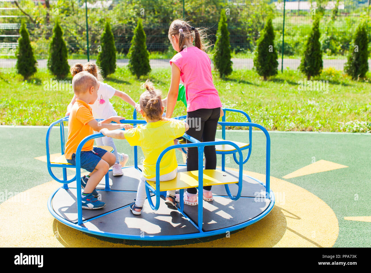 The wonderful carousel on the playground in the summer outdoors Stock ...