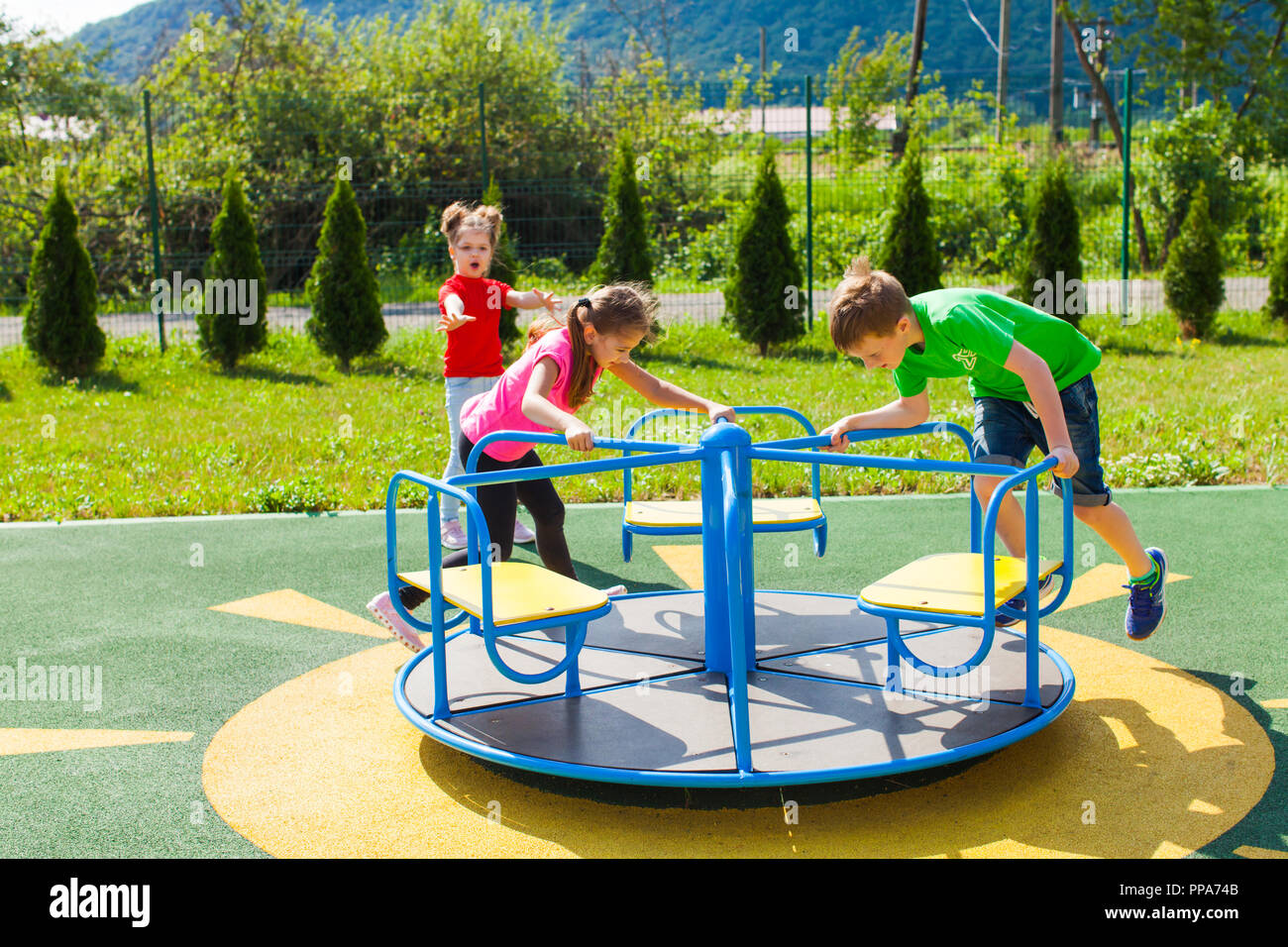Dangerous behavior on the playground in the summer outdoors Stock Photo ...