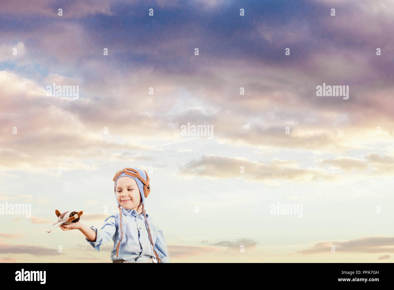 Little boy pilot in the sunset sky Stock Photo - Alamy