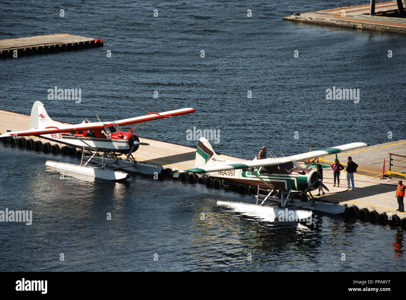 Seaplanes tied up alongside a jetty in Ketchikan, Alaska Stock Photo ...