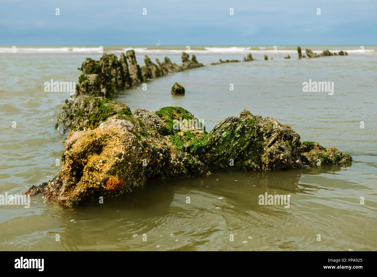 Leftovers of a shipwreck from a World War ship at a beach in northern ...