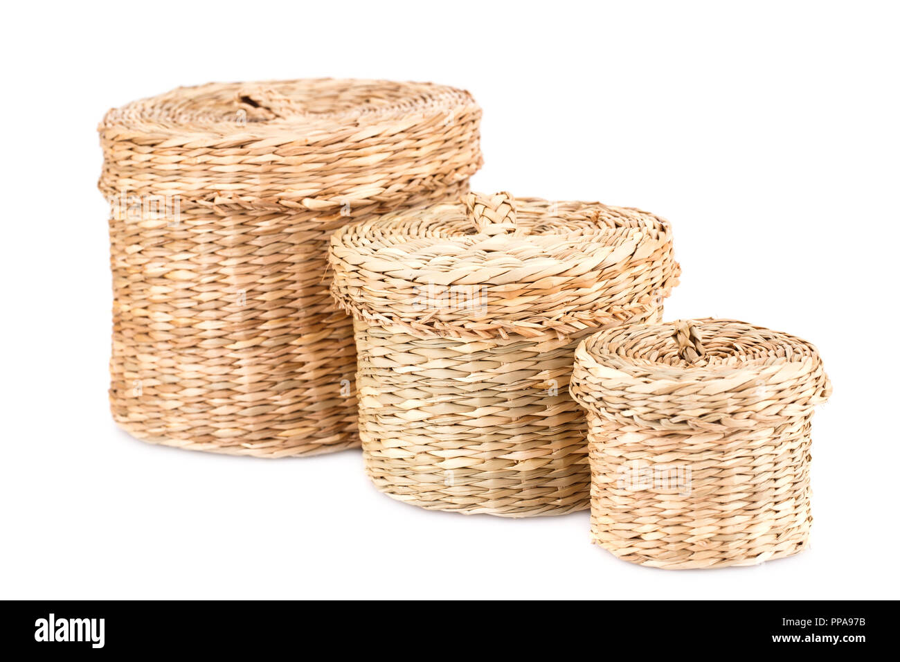 Three wicker boxes isolated on white background Stock Photo - Alamy