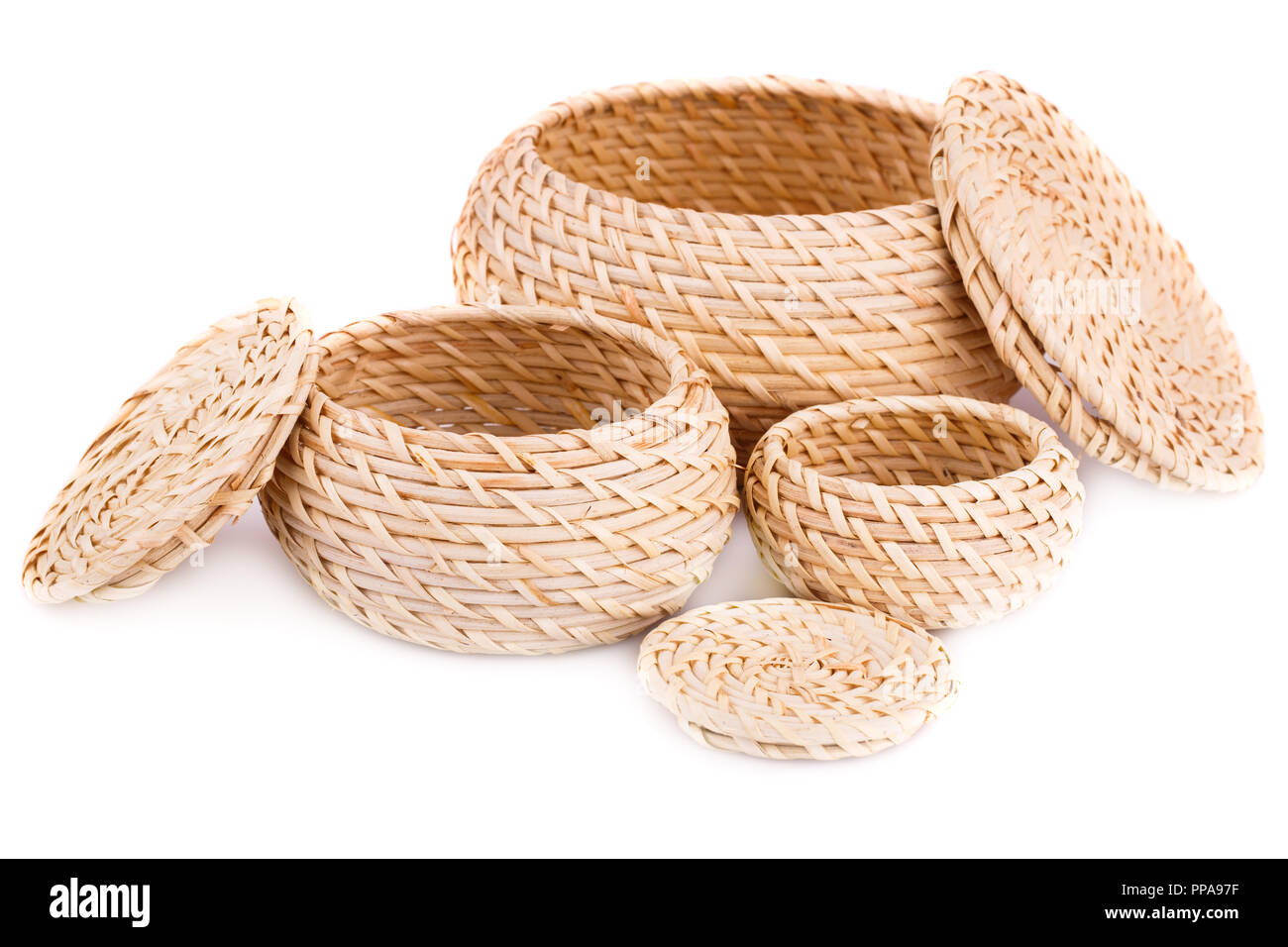 Three wicker boxes isolated on white background Stock Photo - Alamy