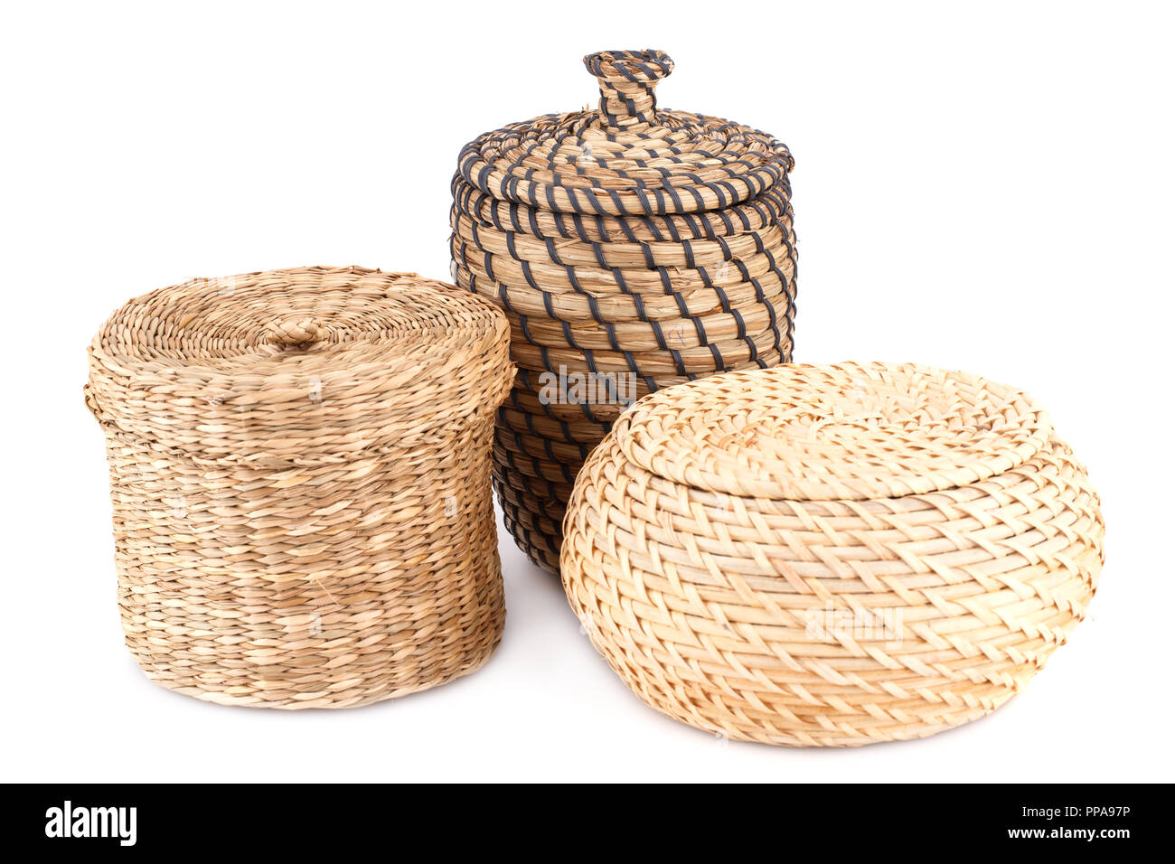 Three wicker boxes isolated on white background Stock Photo - Alamy