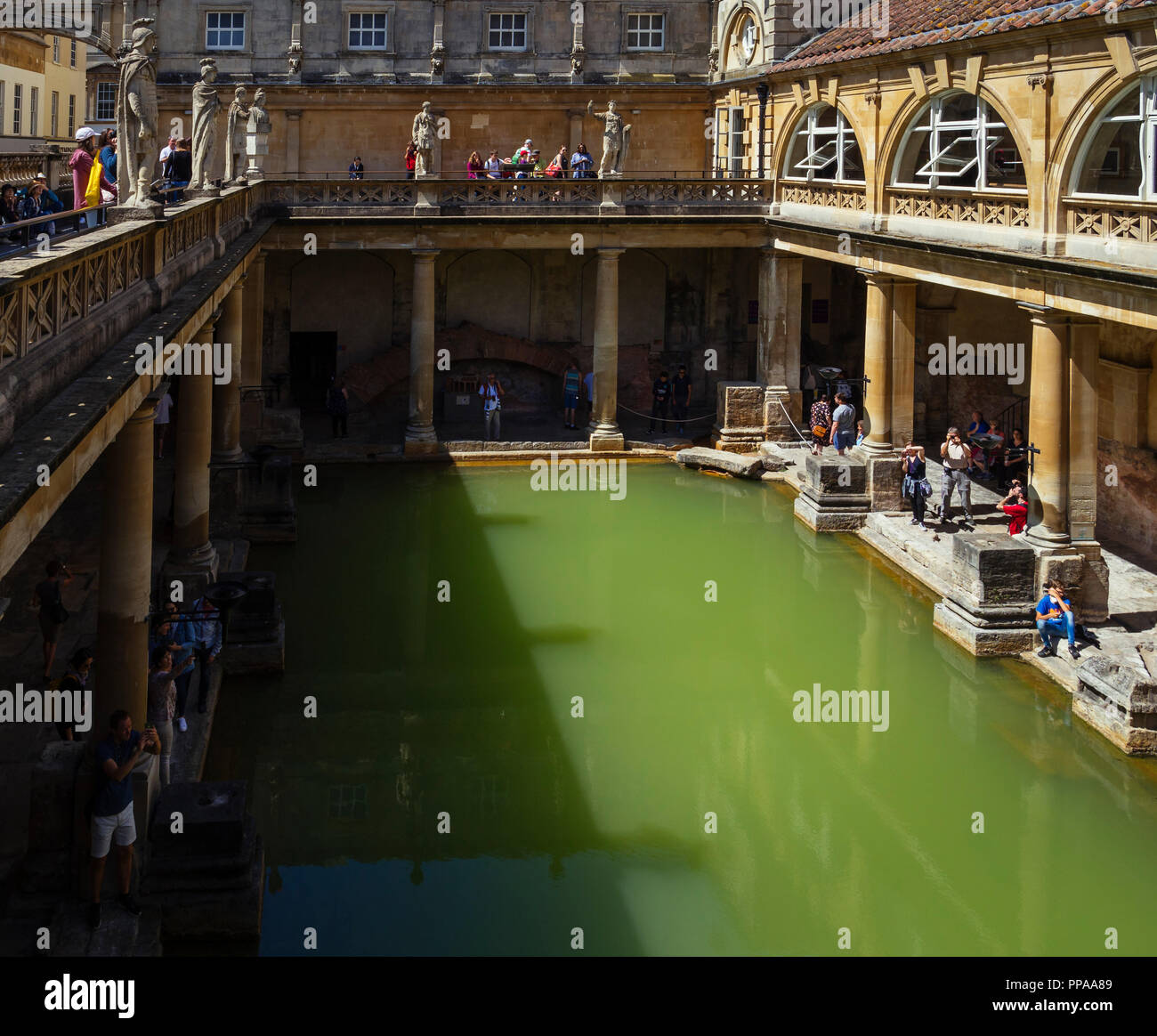 Visitors exploring the Terrace and Great Bath of the Roman Baths, in ...