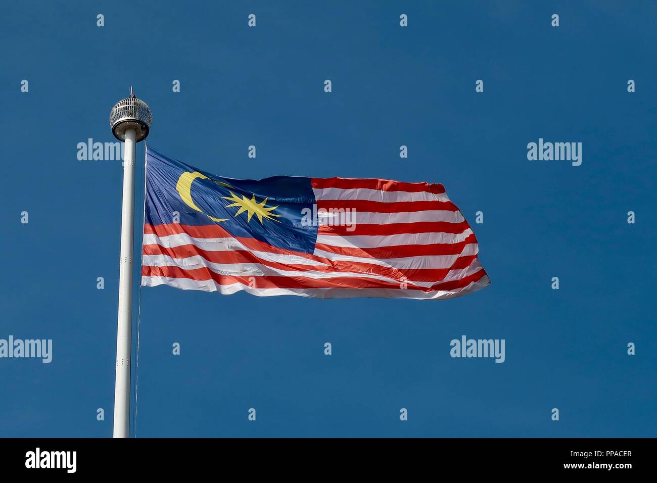 Malaysian flag flying over Dataran Merdeka, Kuala Lumpur Stock Photo ...