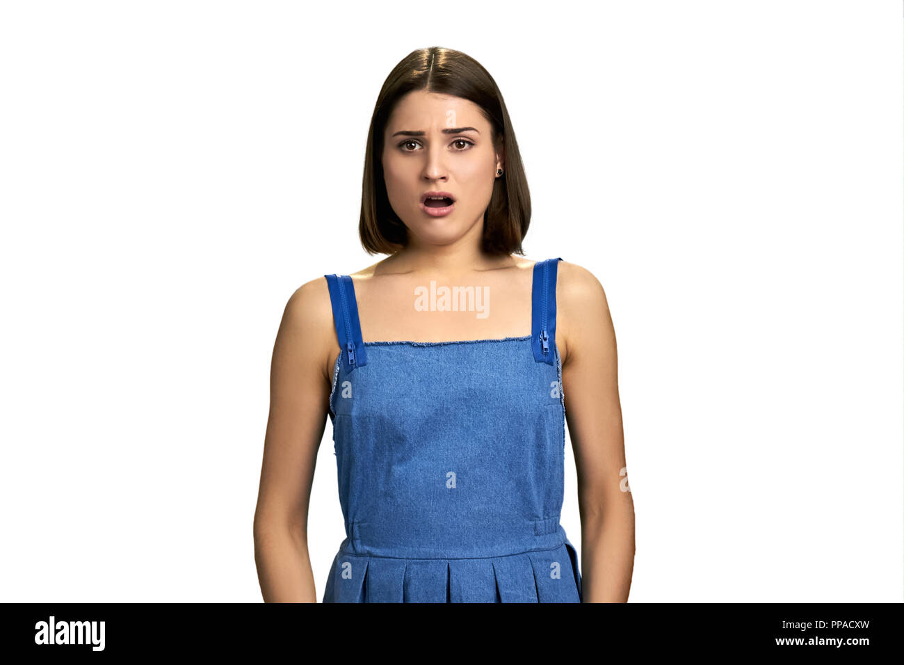 Young pretty woman looking unhappy and shocked. Scared stressed girl ...