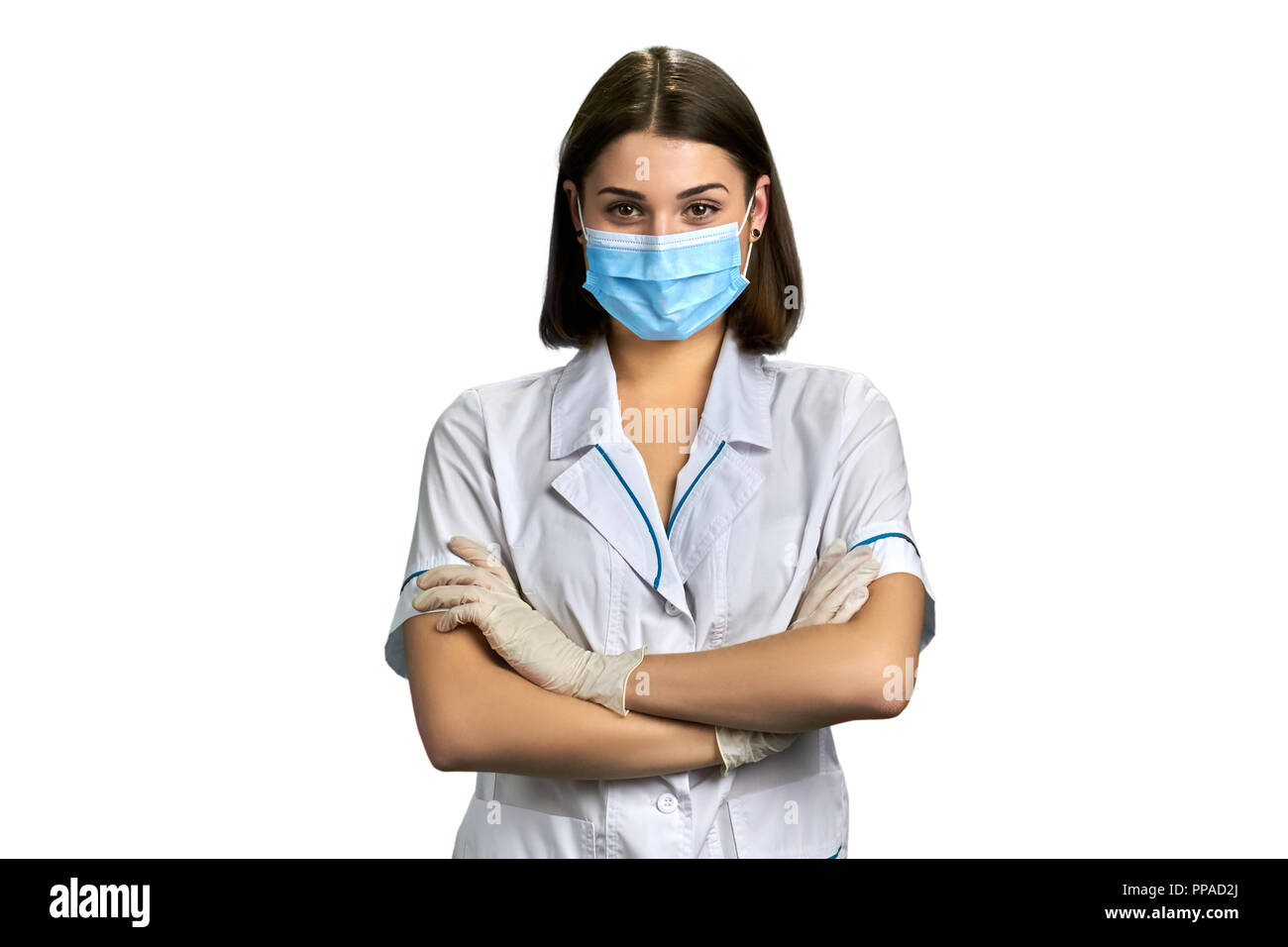 Portrait of doctor with crossed arms. Pretty female physician in ...