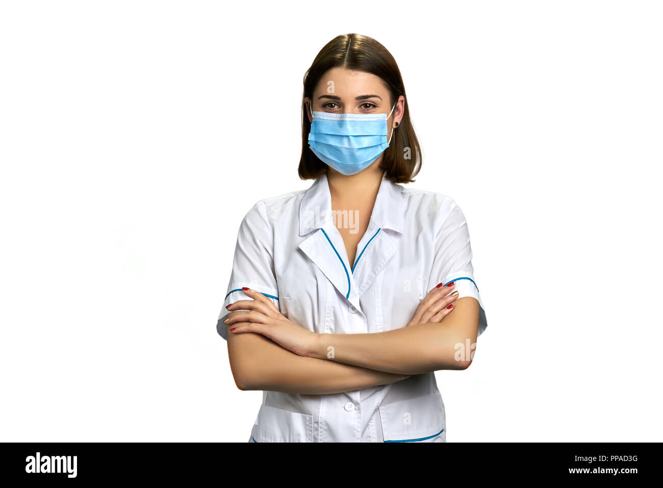 Woman doctor in face mask on white background. Beautiful female doctor ...