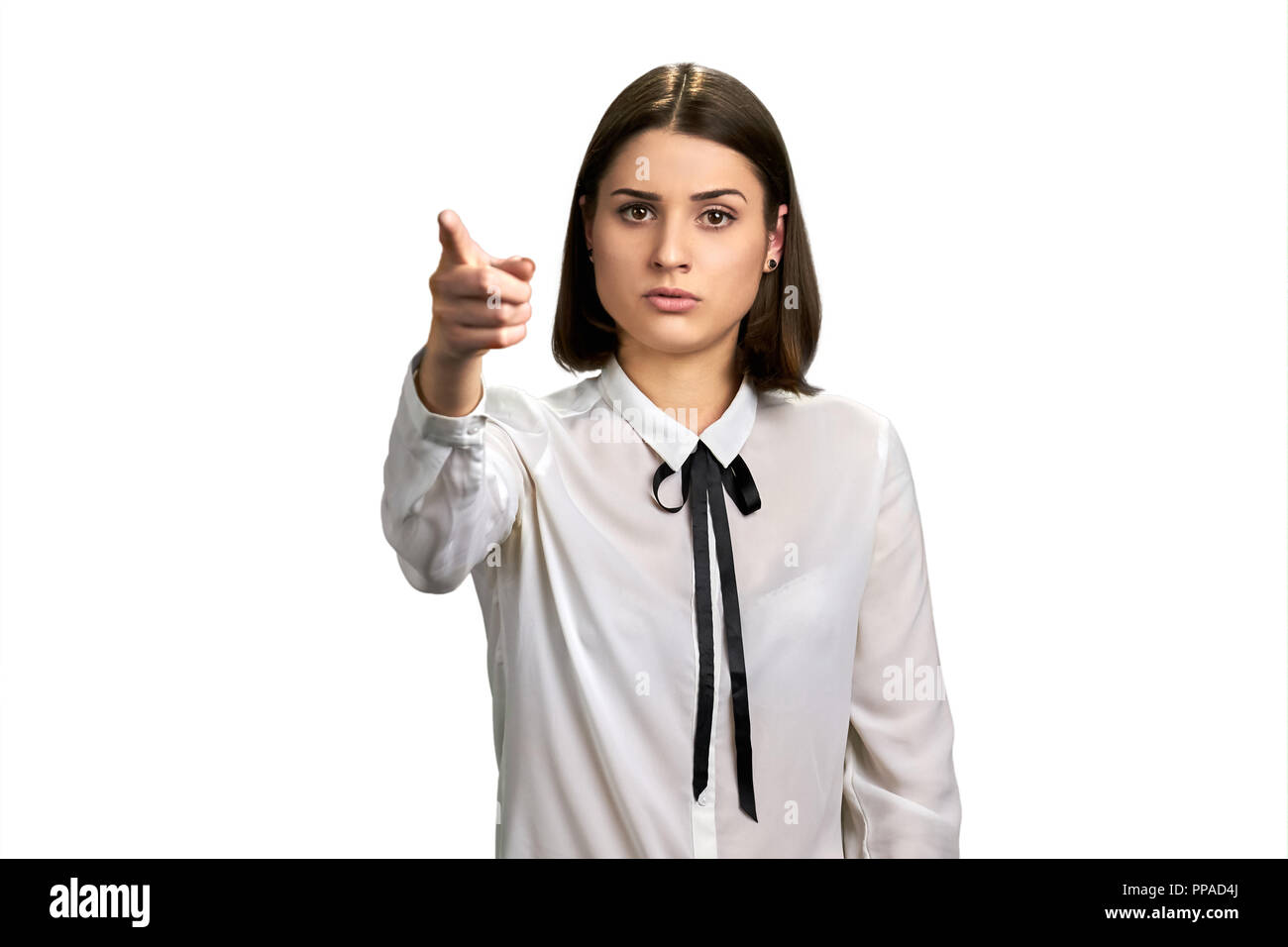 Confident young woman pointing forward Stock Photo - Alamy