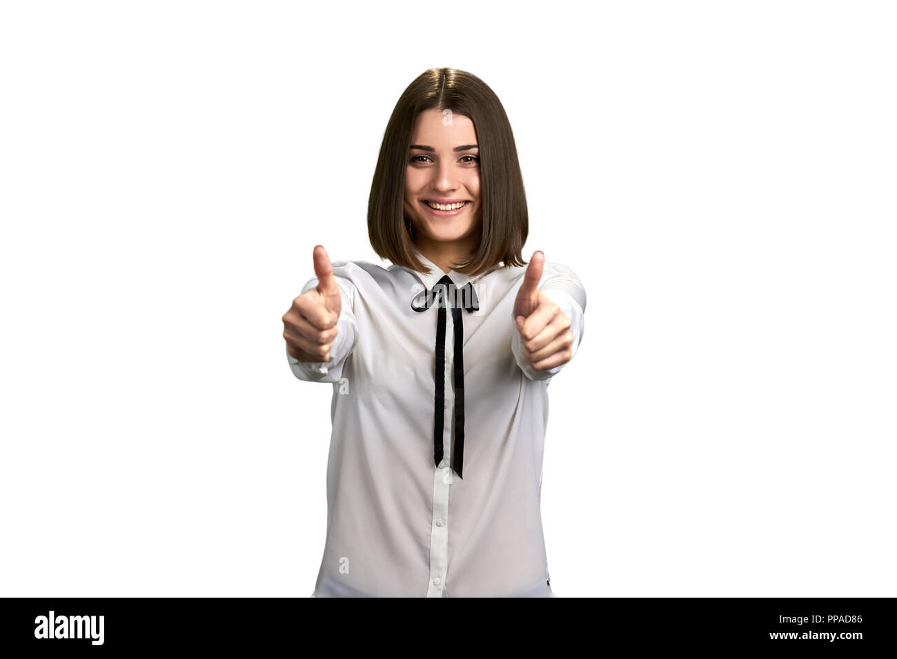 Beautiful girl giving two thumbs up Stock Photo - Alamy