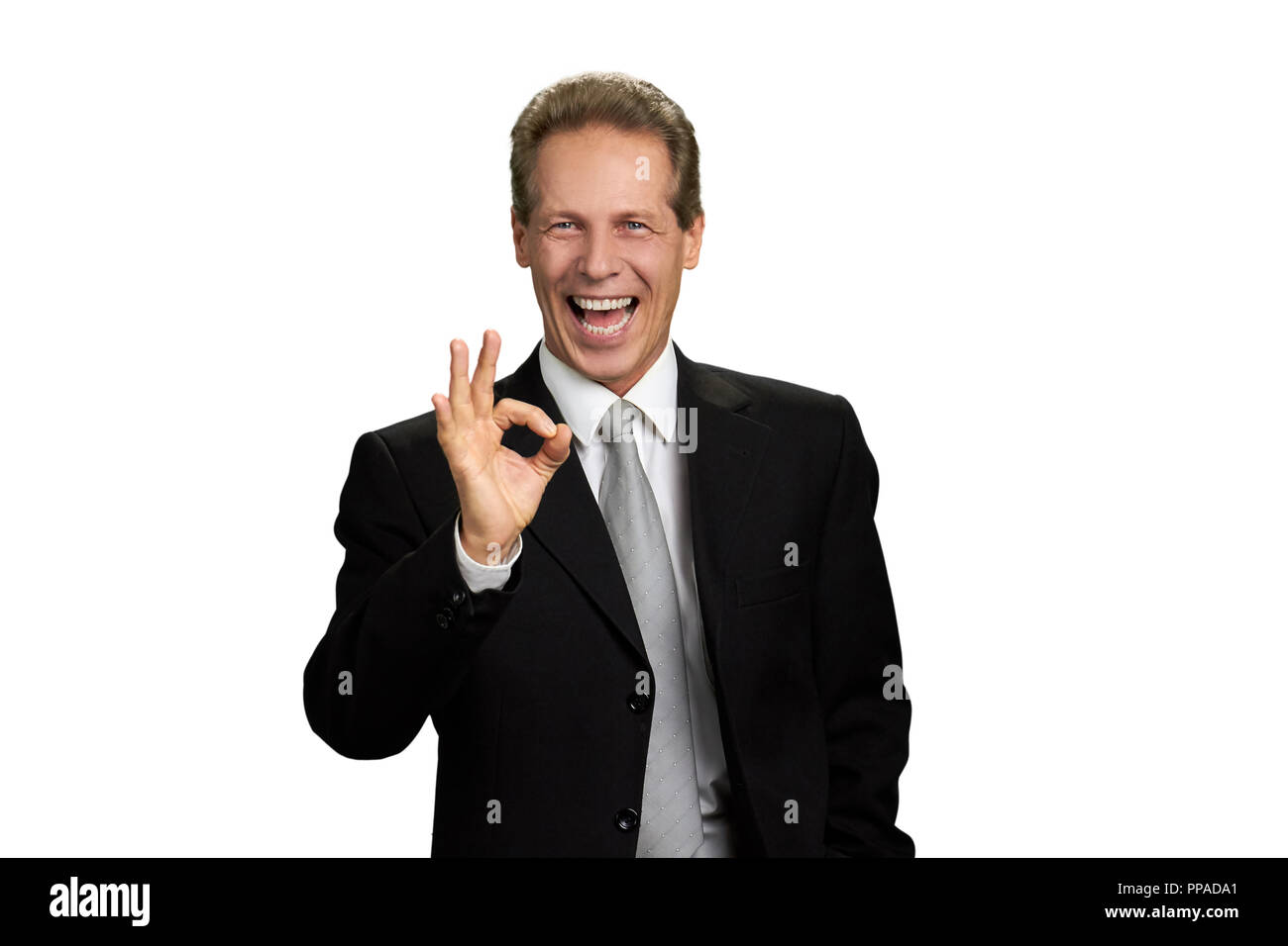 Portrait of businessman showing ok sign Stock Photo - Alamy