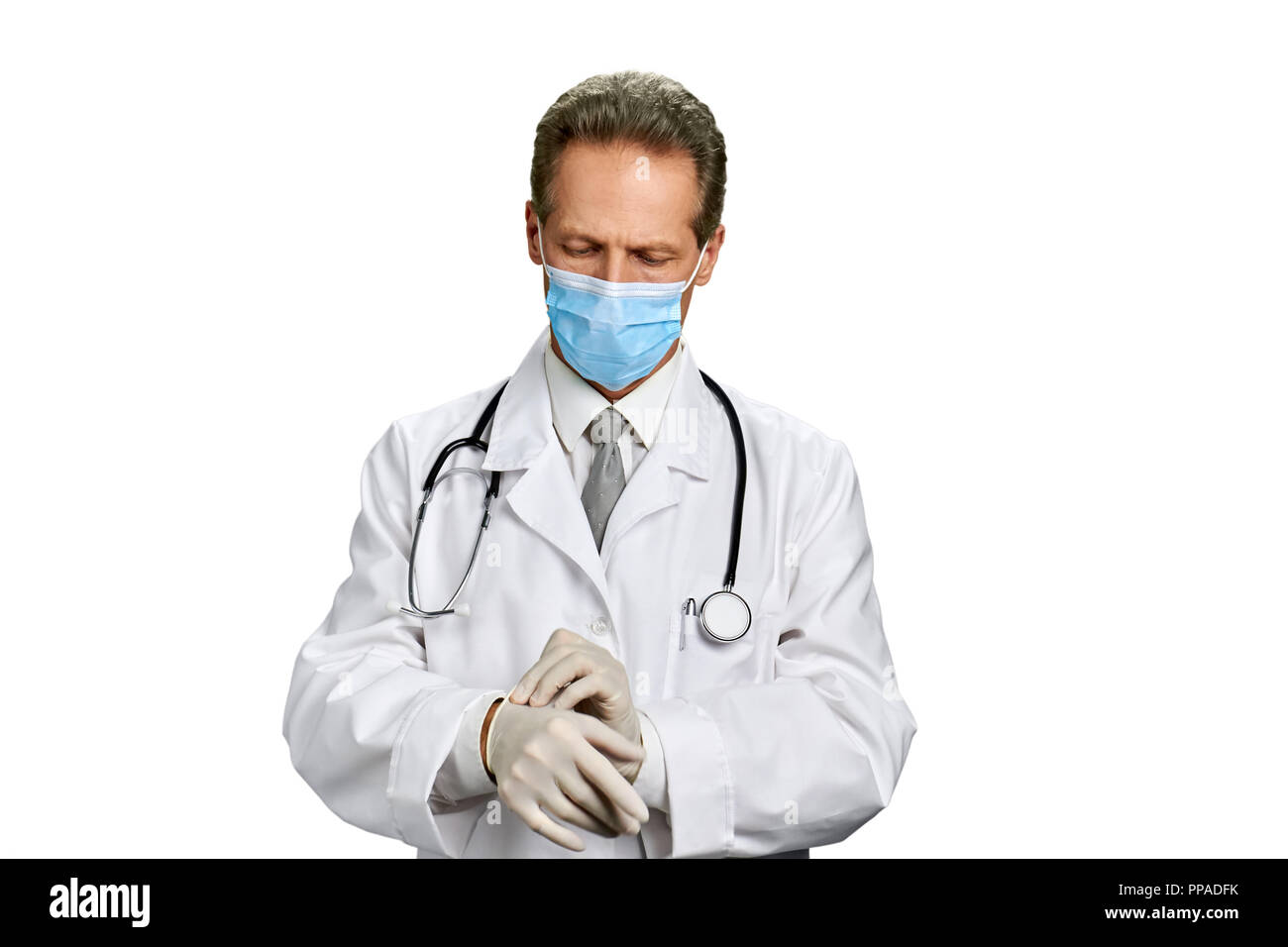 Mature doctor in mask hi-res stock photography and images - Alamy