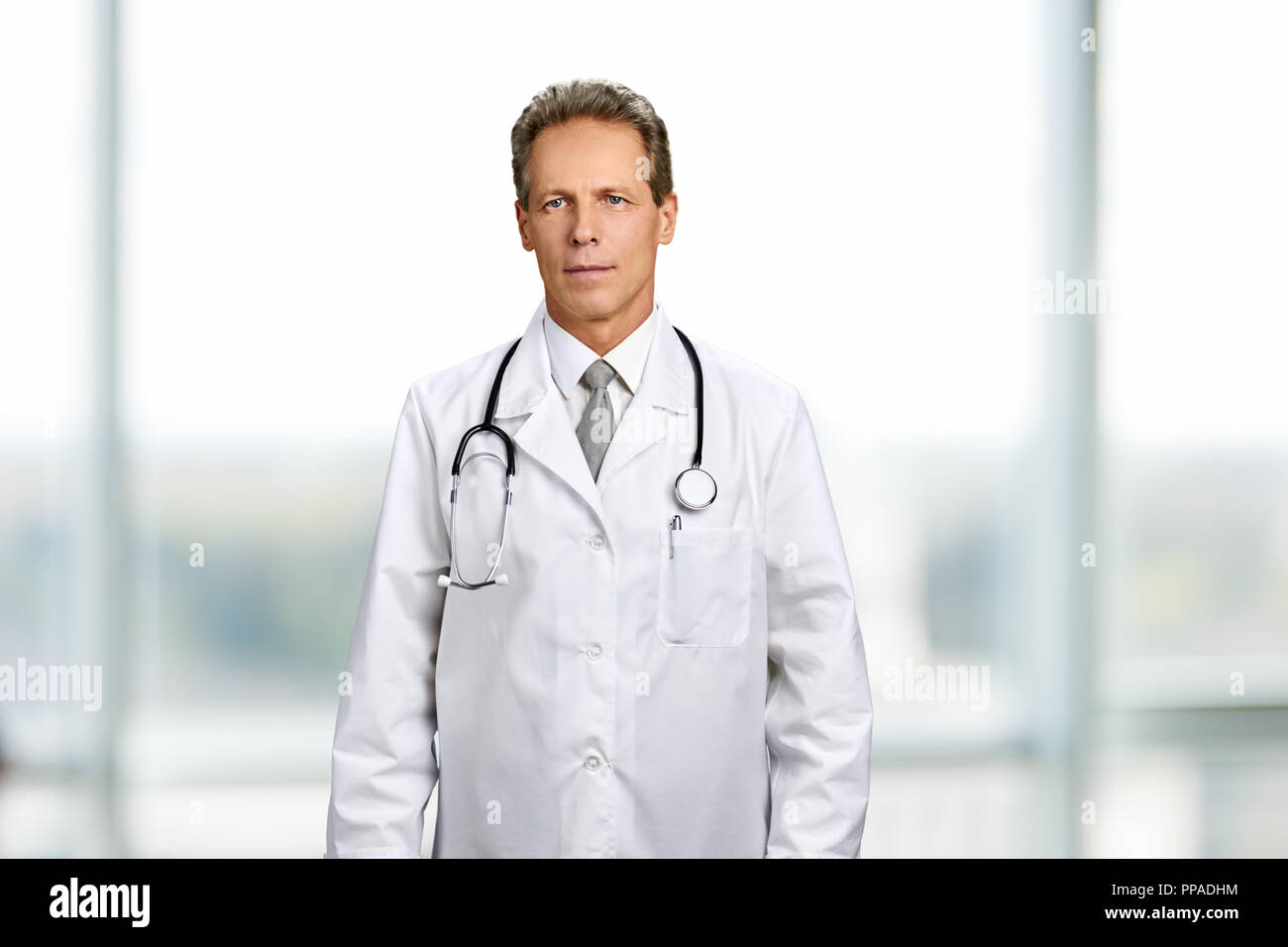 Professional male doctor with stethoscope Stock Photo - Alamy