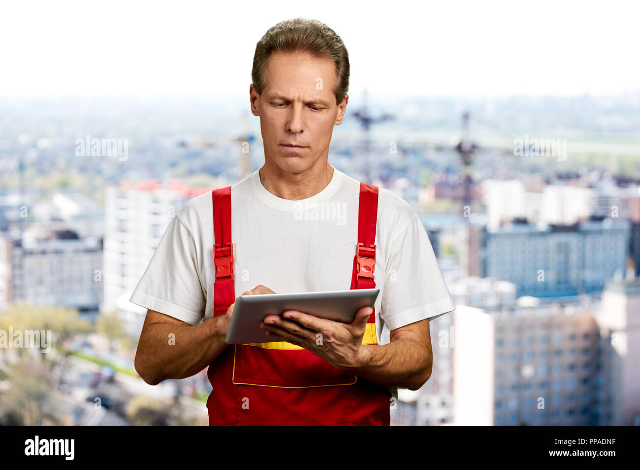 Middle aged foreman tablet hi-res stock photography and images - Alamy