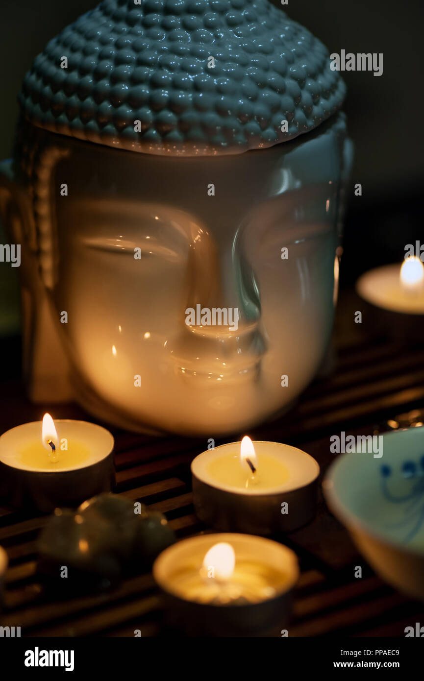 Buddha and candles, Chinese tea ceremony. Vertical orientation Stock ...