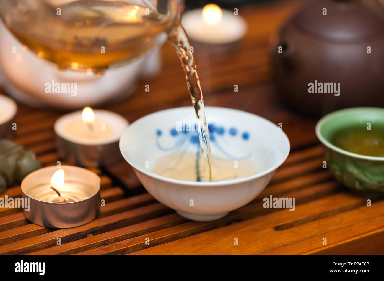Chinese tea ceremony with candles. Close up photo Stock Photo - Alamy